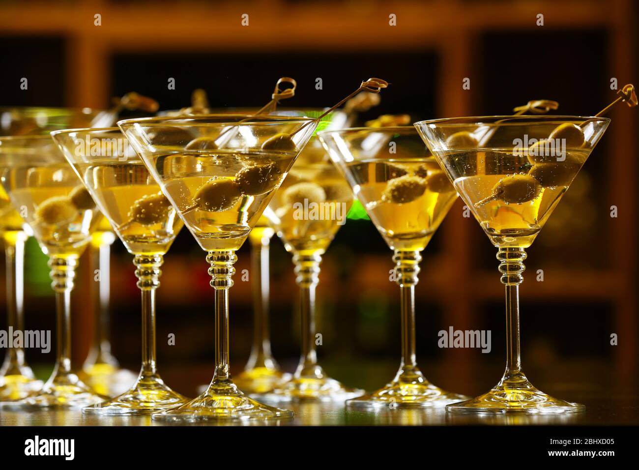 Glasses of cocktails on bar background Stock Photo - Alamy