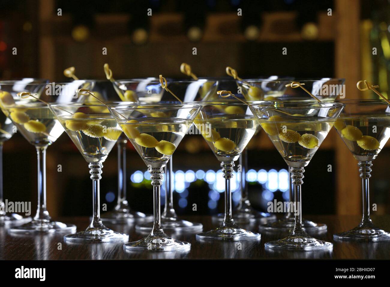 Glasses of cocktails on bar background Stock Photo - Alamy