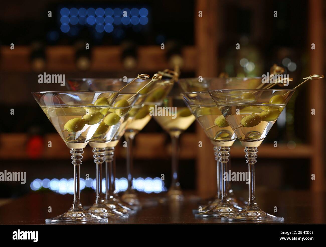 Glasses of cocktails on bar background Stock Photo - Alamy