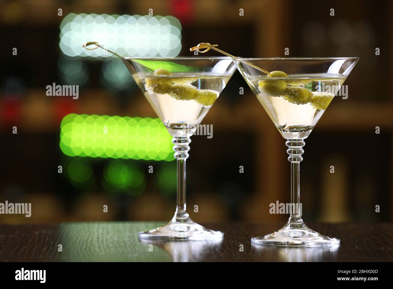 Glasses of cocktails on bar background Stock Photo - Alamy