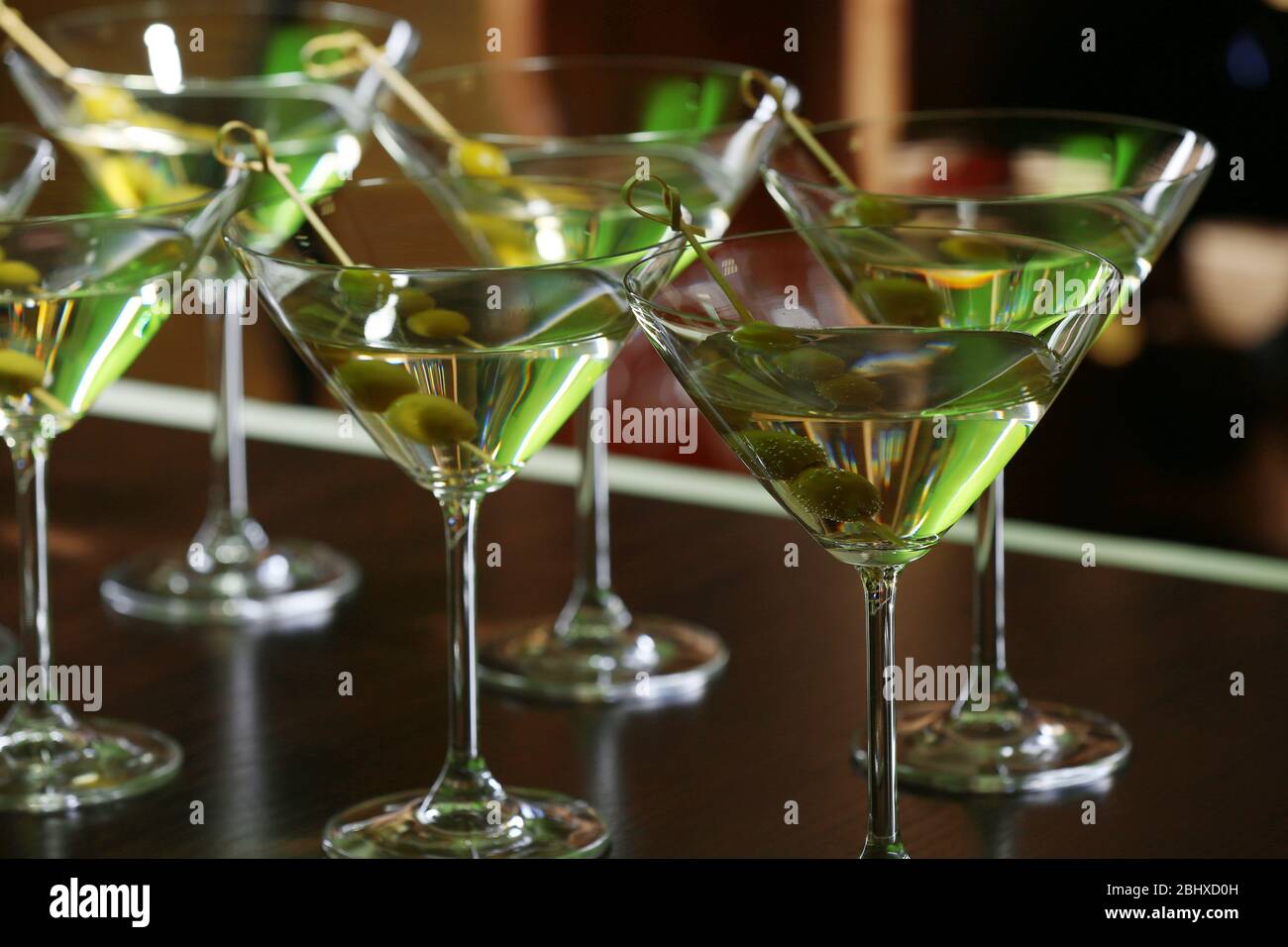 Glasses of cocktails on bar background Stock Photo - Alamy