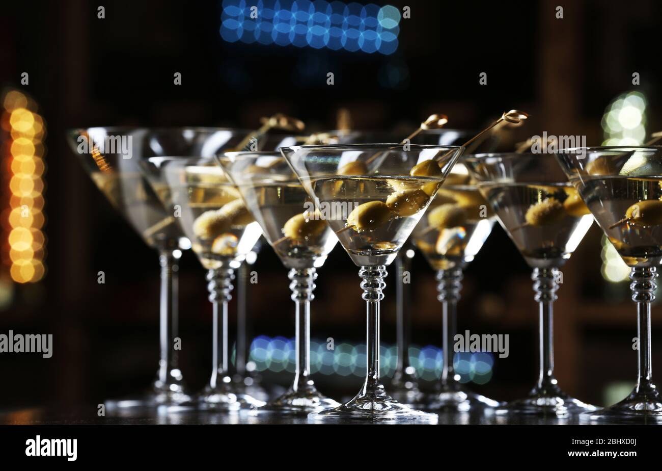 Glasses of cocktails on bar background Stock Photo - Alamy