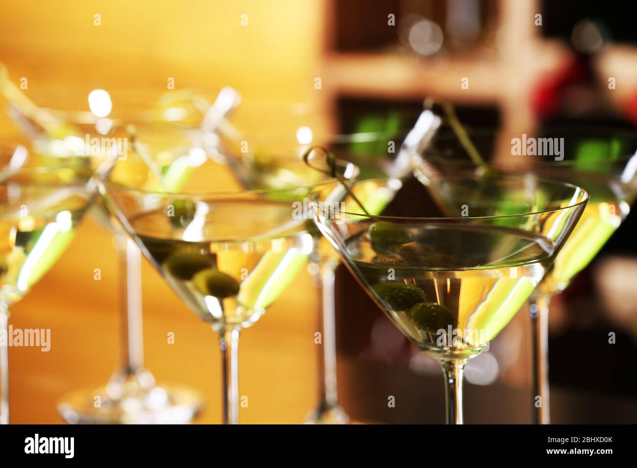Glasses of cocktails on bar background Stock Photo - Alamy
