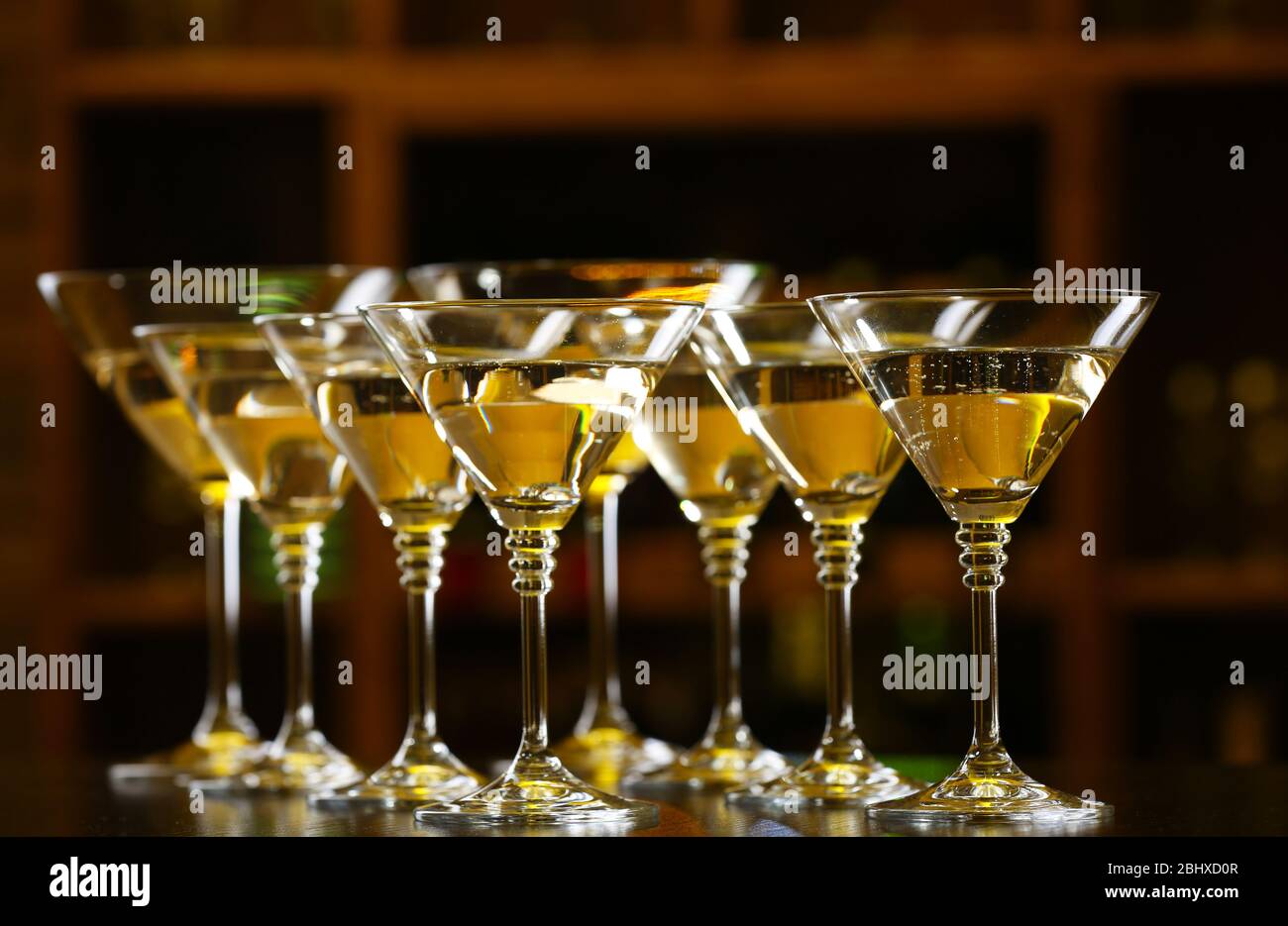 Glasses of cocktails on bar background Stock Photo - Alamy
