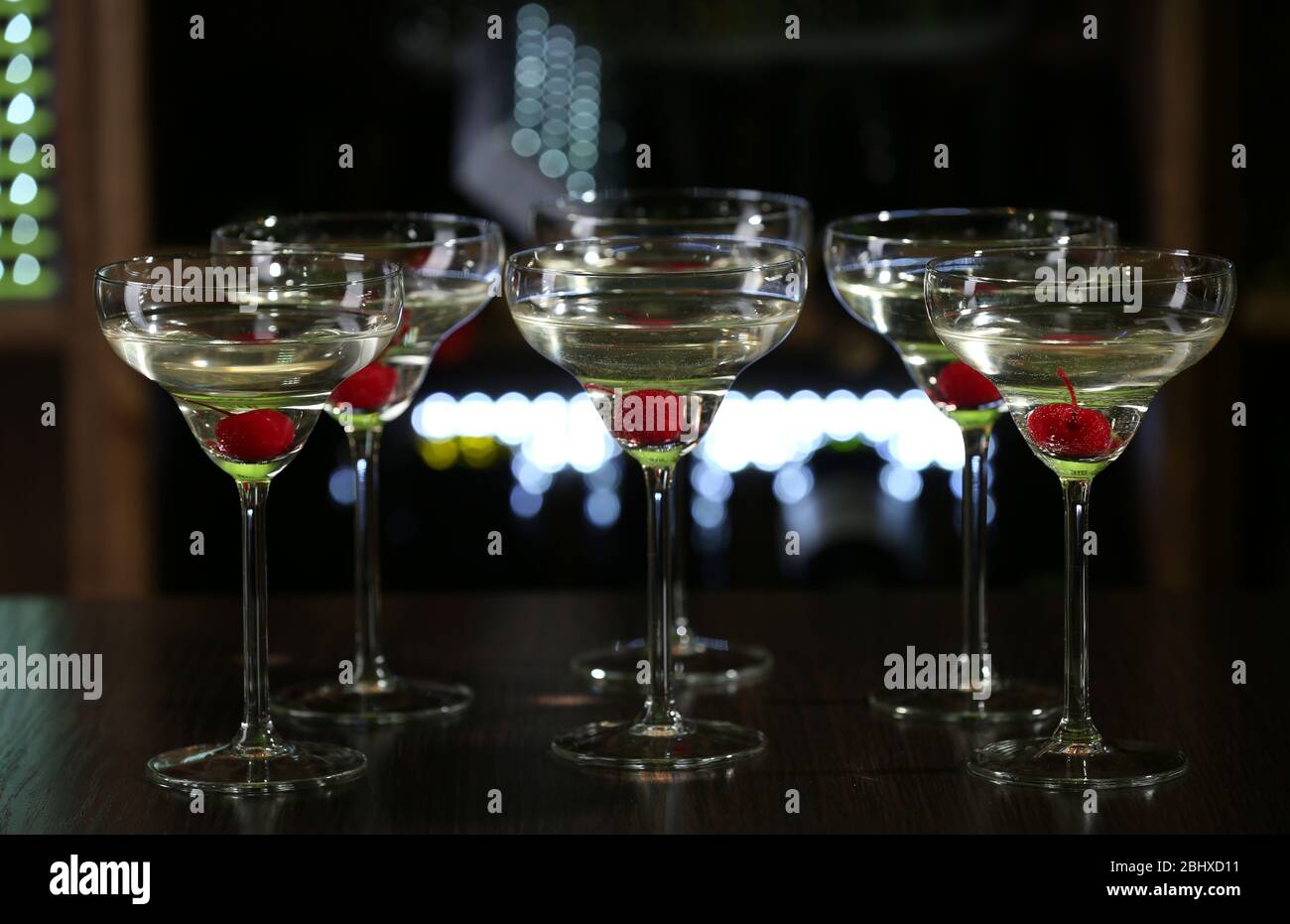Glasses of cocktails on bar background Stock Photo - Alamy