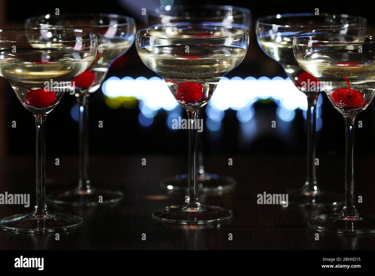 Glasses of cocktails on bar background Stock Photo - Alamy