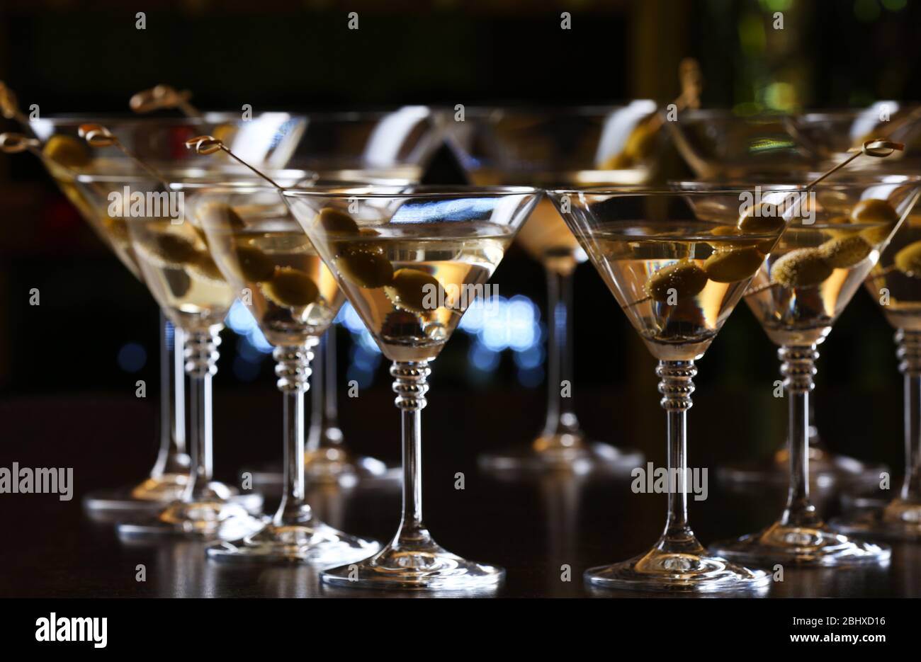 Glasses of cocktails on bar background Stock Photo - Alamy