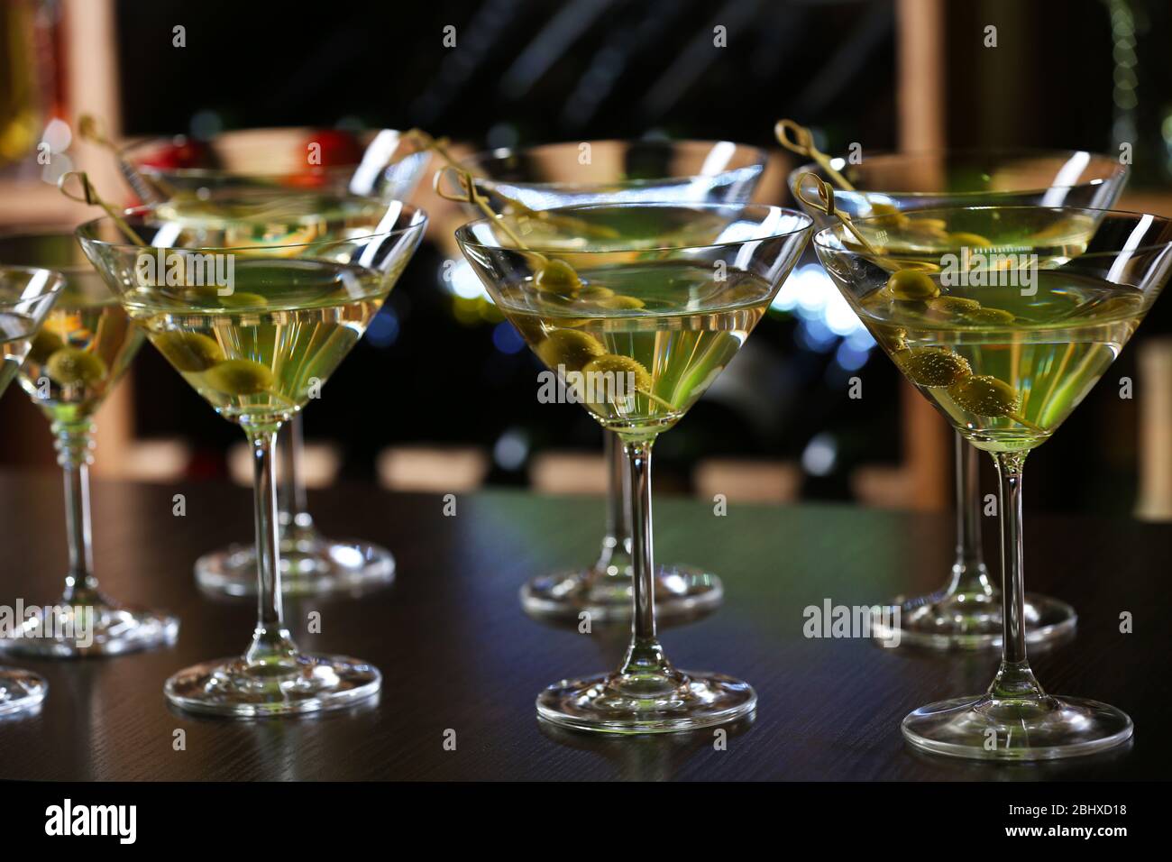 Glasses of cocktails on bar background Stock Photo - Alamy