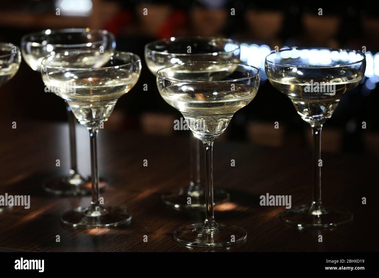 Glasses of cocktails on bar background Stock Photo - Alamy