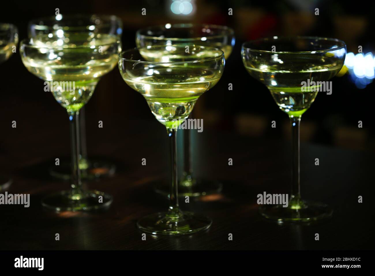 Glasses of cocktails on bar background Stock Photo - Alamy