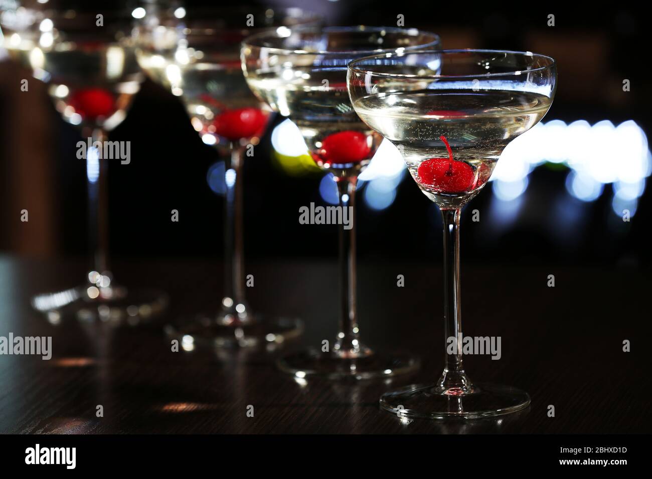 Glasses of cocktails on bar background Stock Photo - Alamy