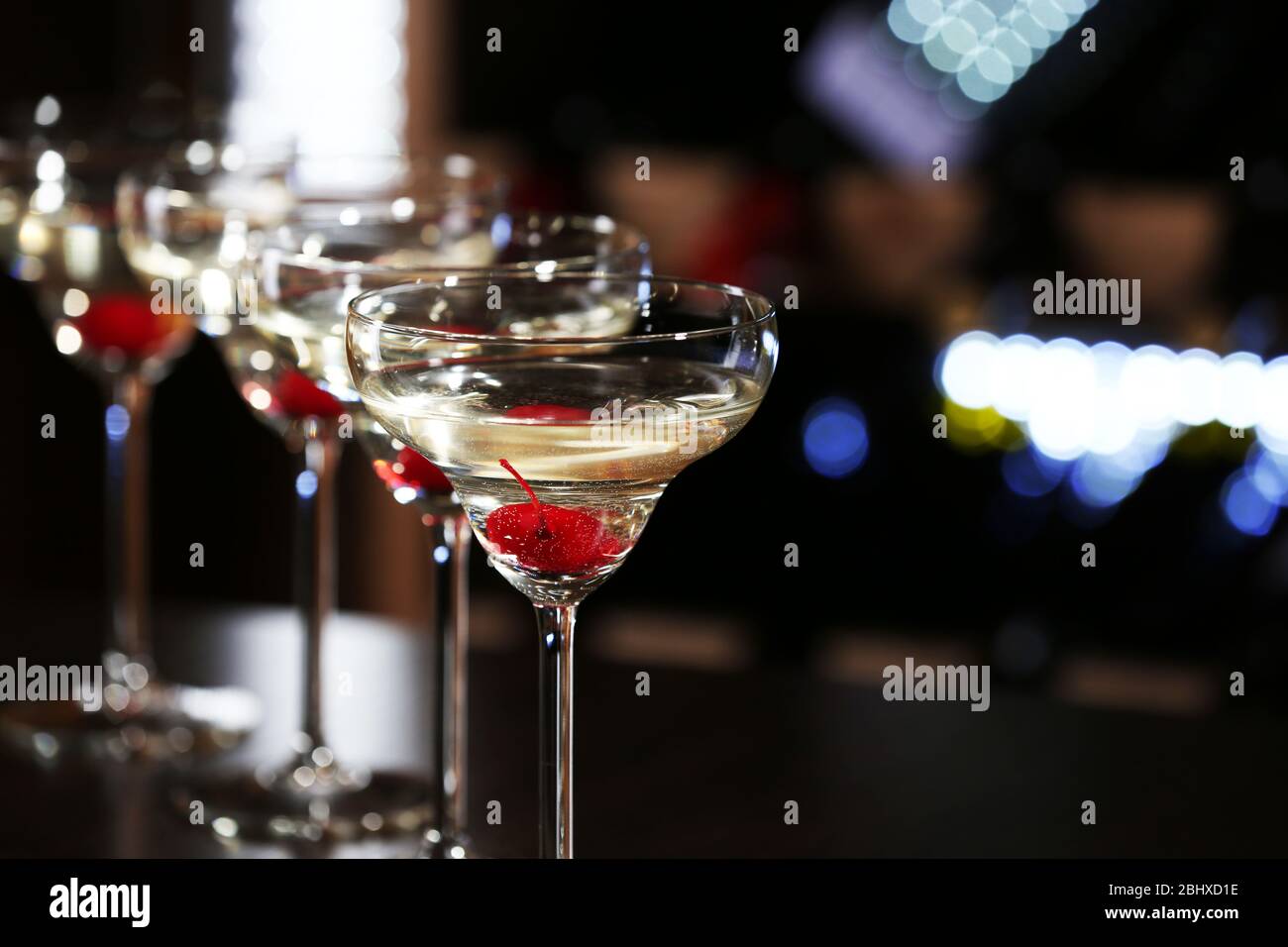 Glasses of cocktails on bar background Stock Photo - Alamy