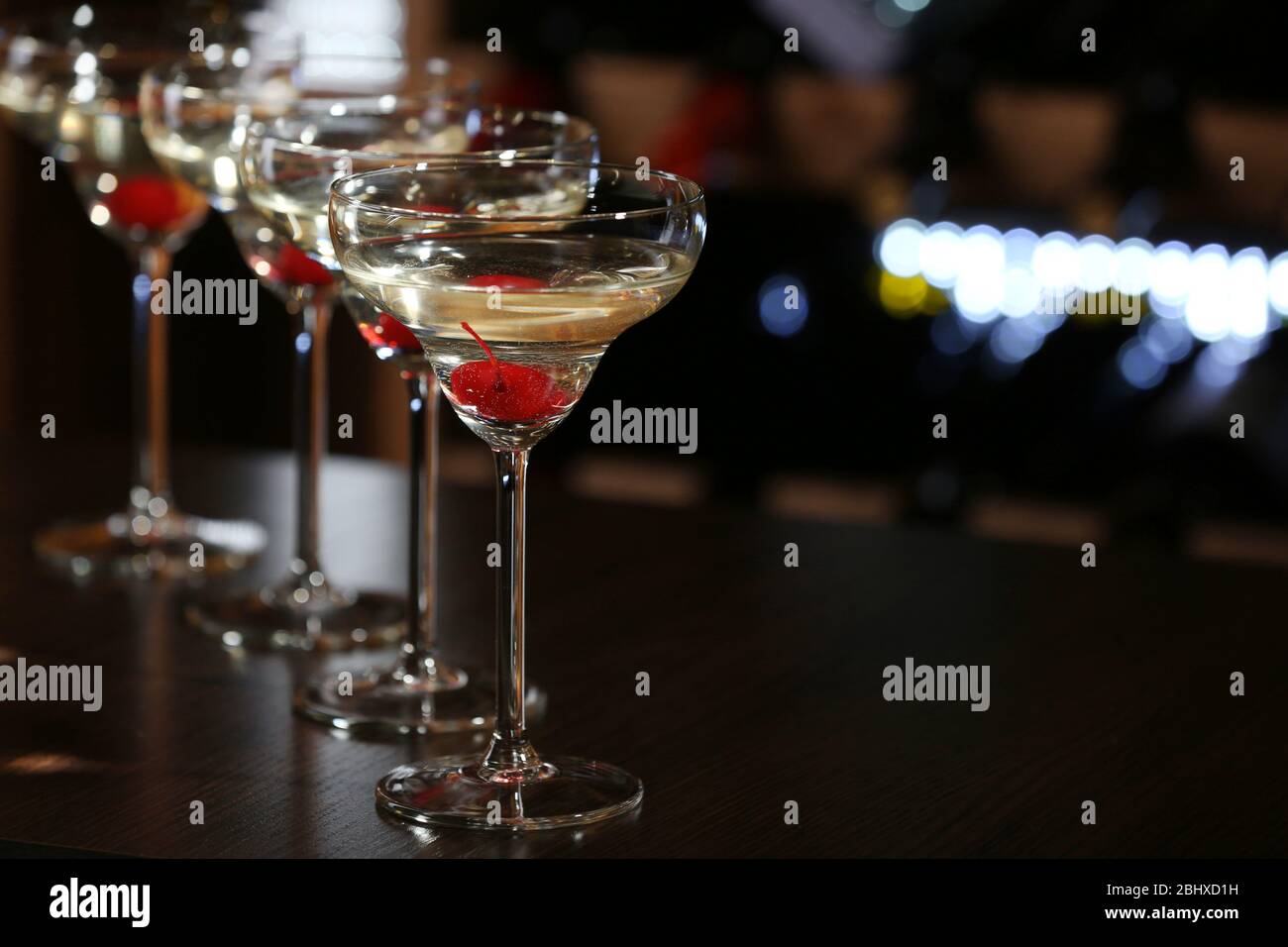 Glasses of cocktails on bar background Stock Photo - Alamy