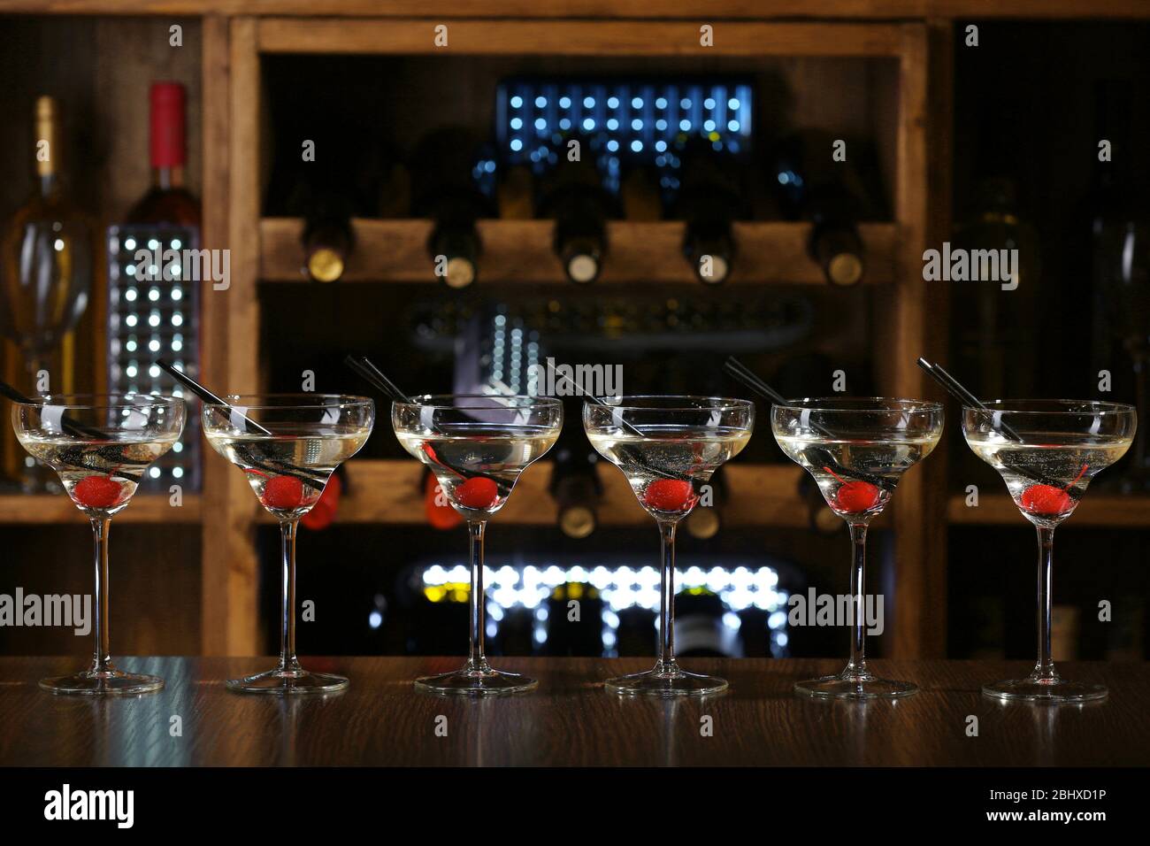 Glasses of cocktails on bar background Stock Photo - Alamy