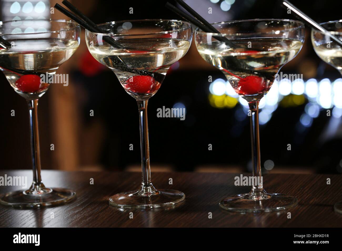 Glasses of cocktails on bar background Stock Photo - Alamy