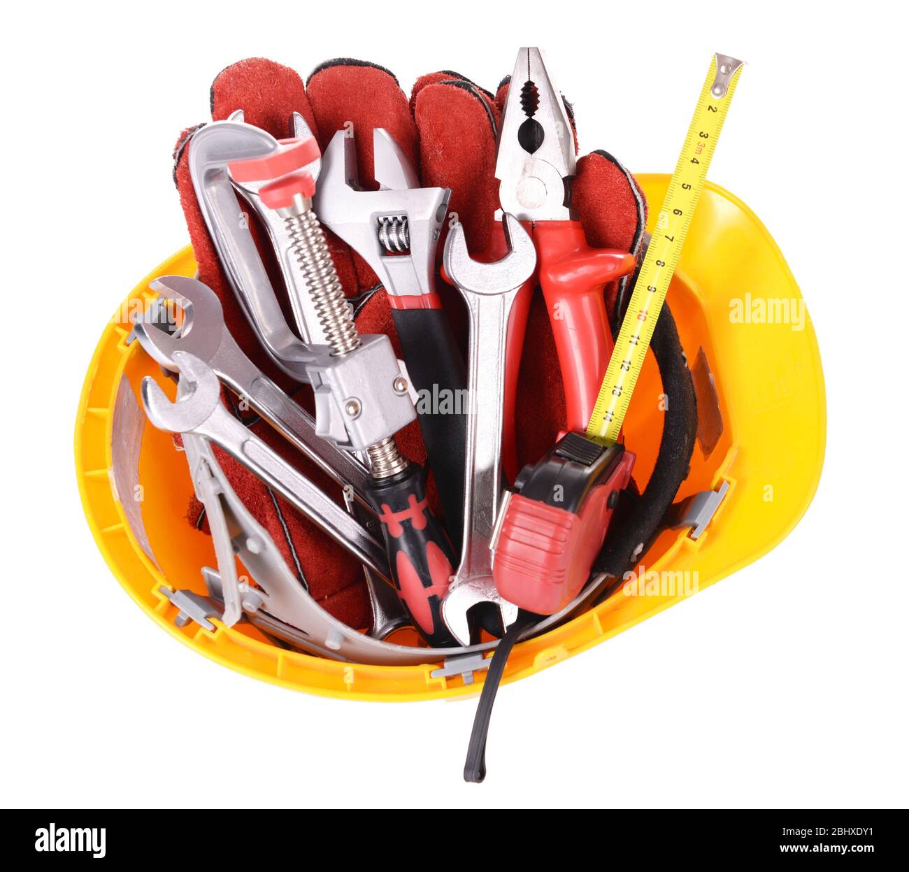 Construction tools in helmet isolated on white Stock Photo - Alamy