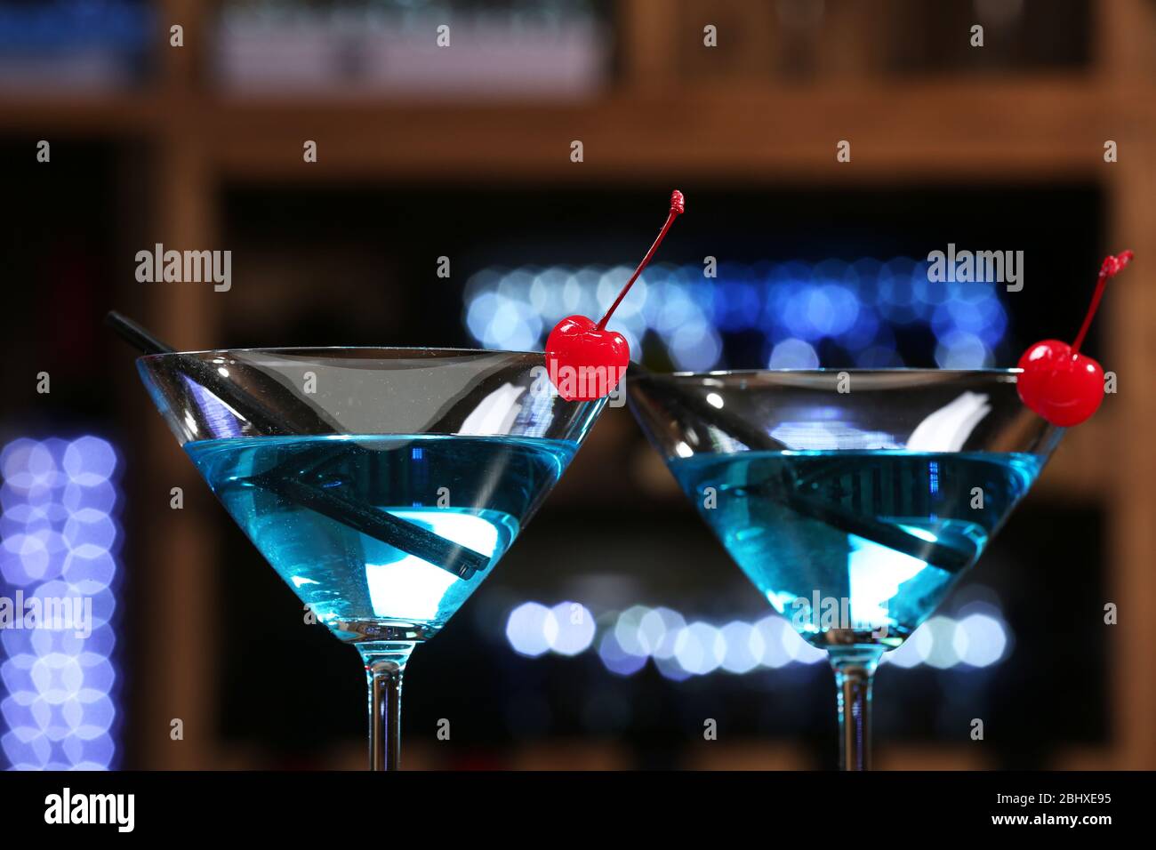 Glasses of cocktails on bar background Stock Photo - Alamy