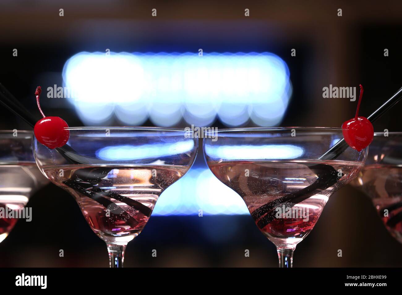 Glasses of cocktails on bar background Stock Photo - Alamy
