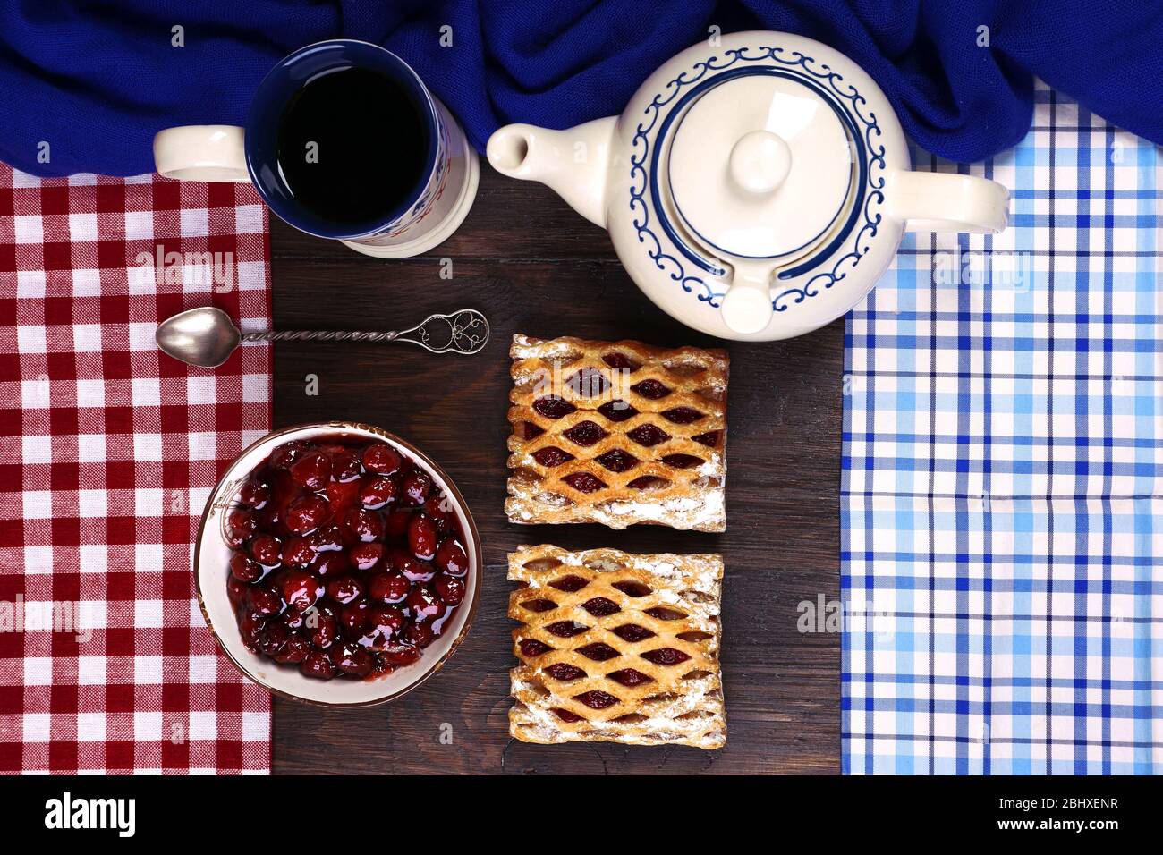 Baking, tea and jam on wooden table top view Stock Photo - Alamy
