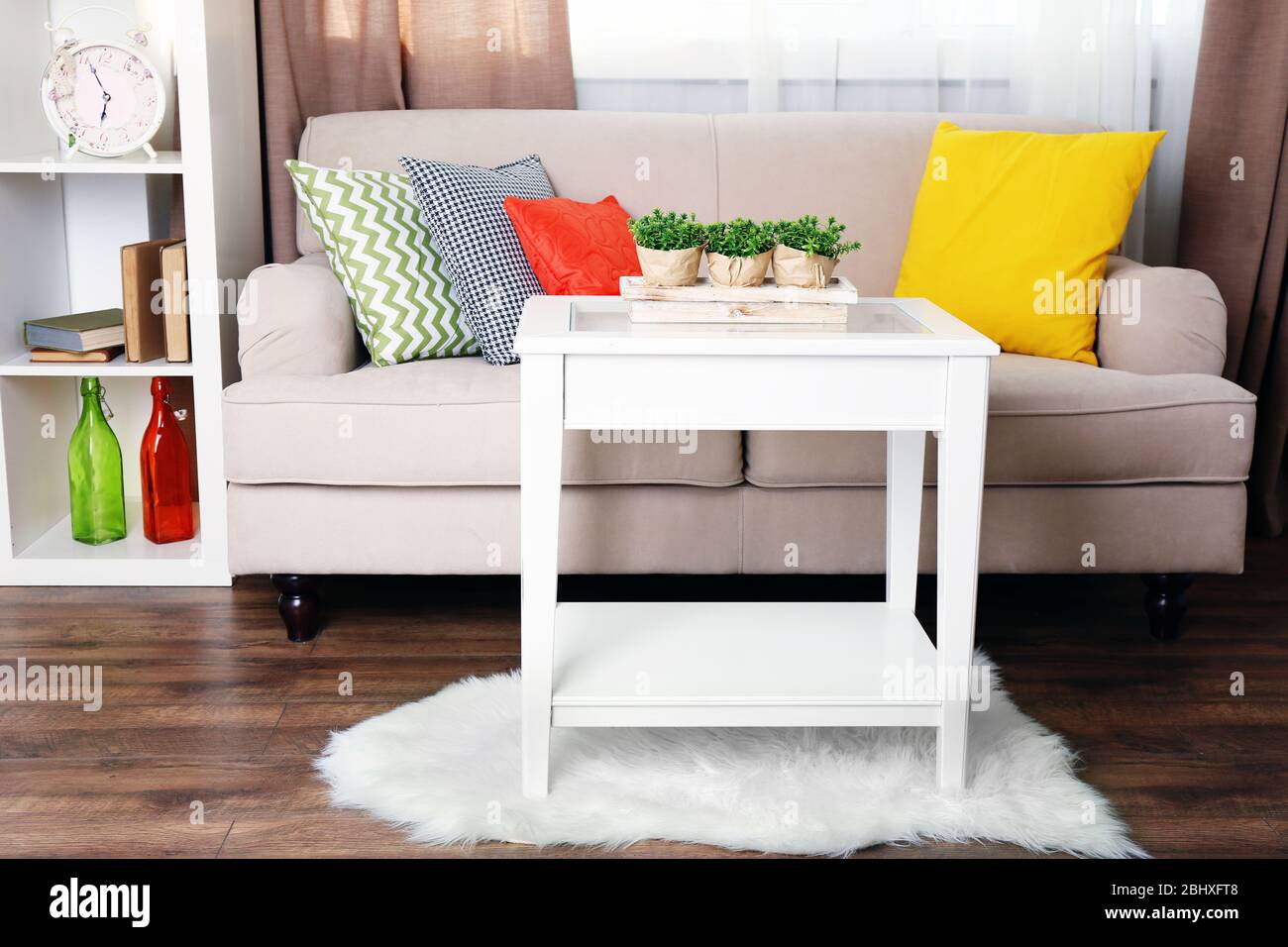 Modern interior with comfortable sofa in room Stock Photo - Alamy