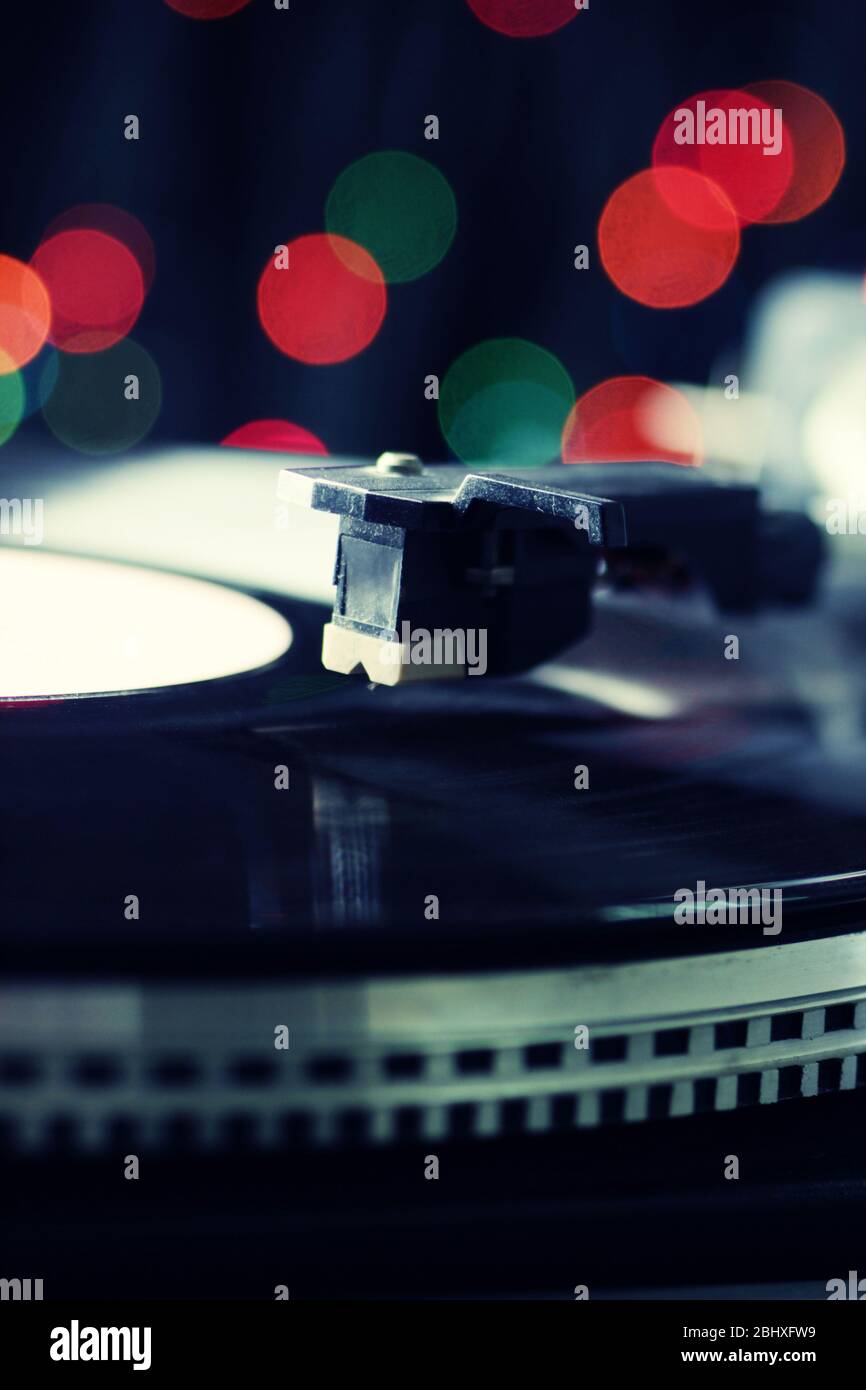 Gramophone with a vinyl record on colorful blurred background Stock ...