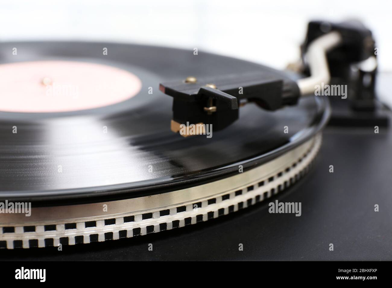 Gramophone with a vinyl record, closeup Stock Photo - Alamy