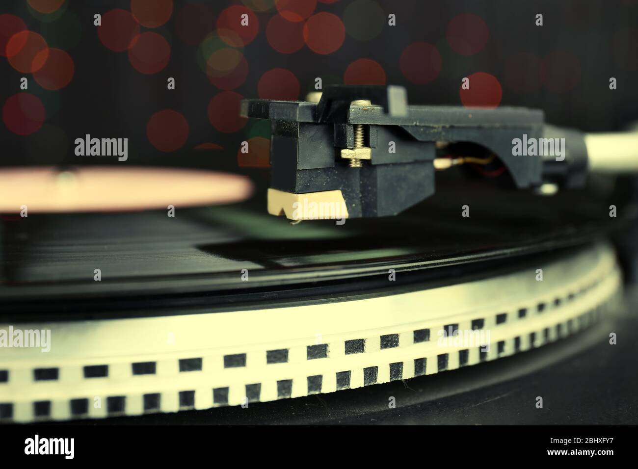 Gramophone with a vinyl record on colorful blurred background Stock ...