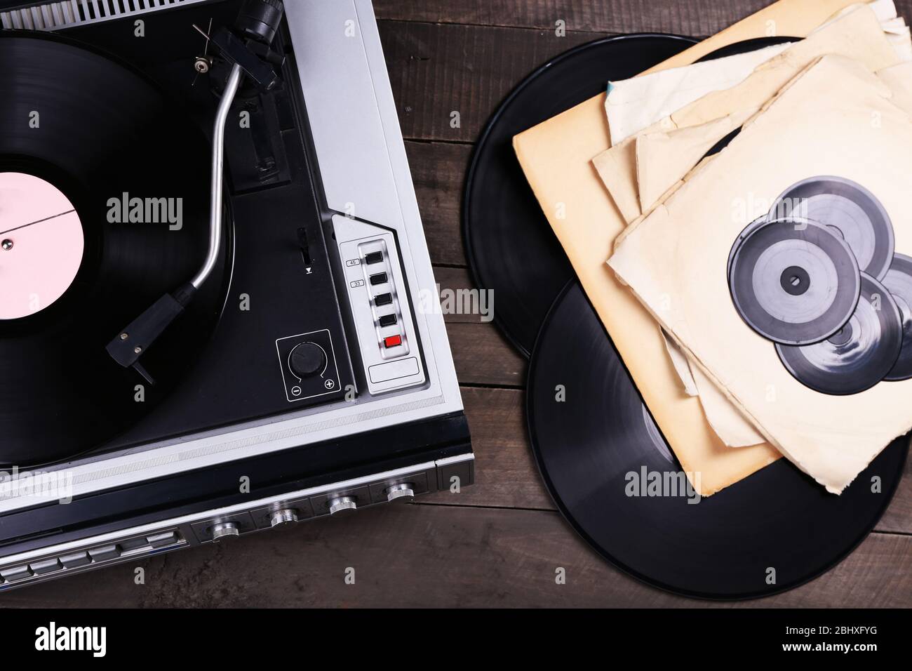 Gramophone with a vinyl record on wooden table, top view Stock Photo ...