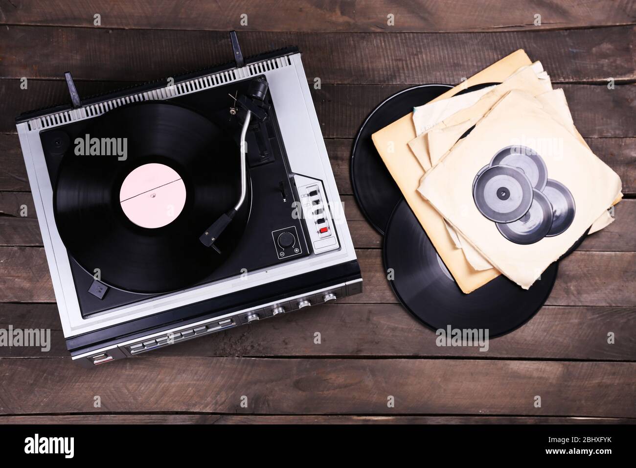 Gramophone with a vinyl record on wooden table, top view Stock Photo ...