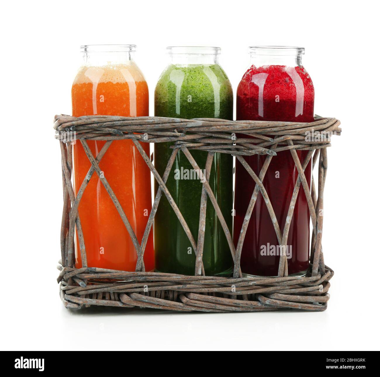 Assortment of healthy fresh juices in glass bottles, isolated on white ...