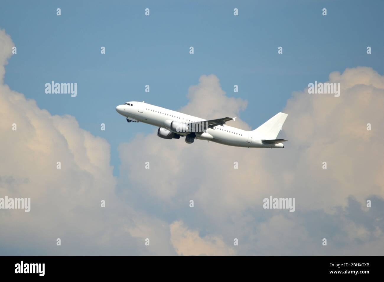 Passenger airplane flying side clouds hi-res stock photography and ...