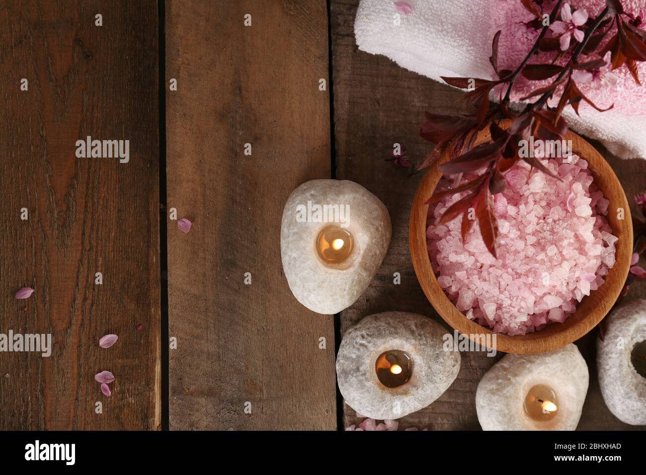 Beautiful spa composition with spring flowers on wooden background ...