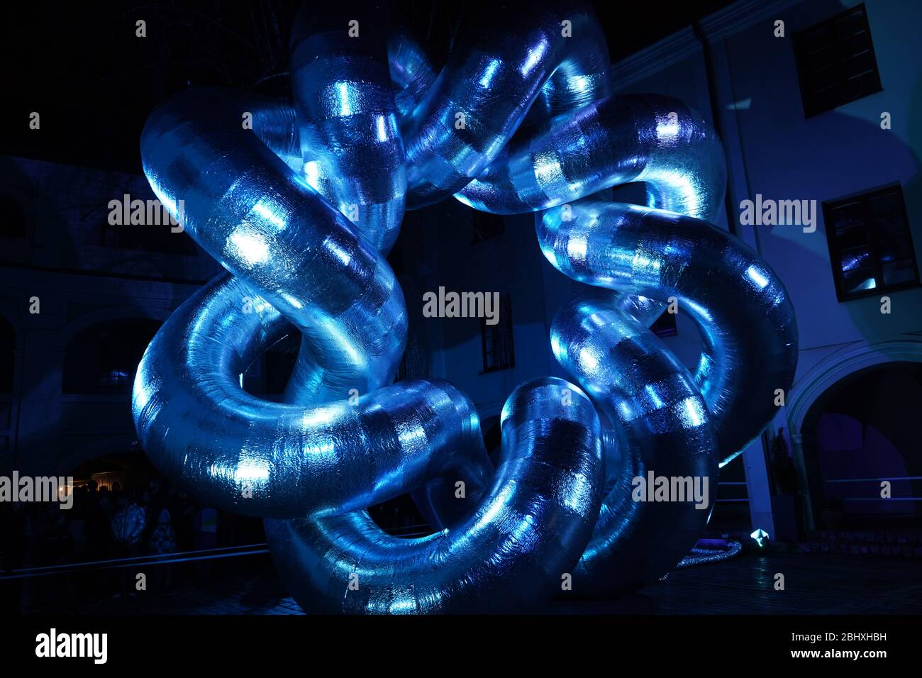 Circle shape object in blue light at night Stock Photo - Alamy