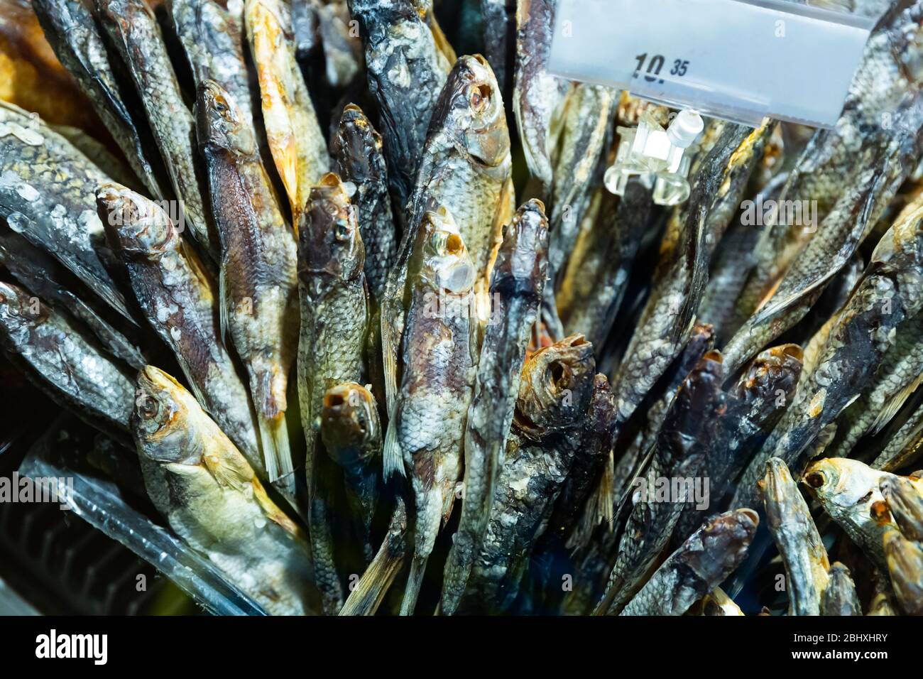 Dried salted freshwater fish on store counter. Traditional Russian ...