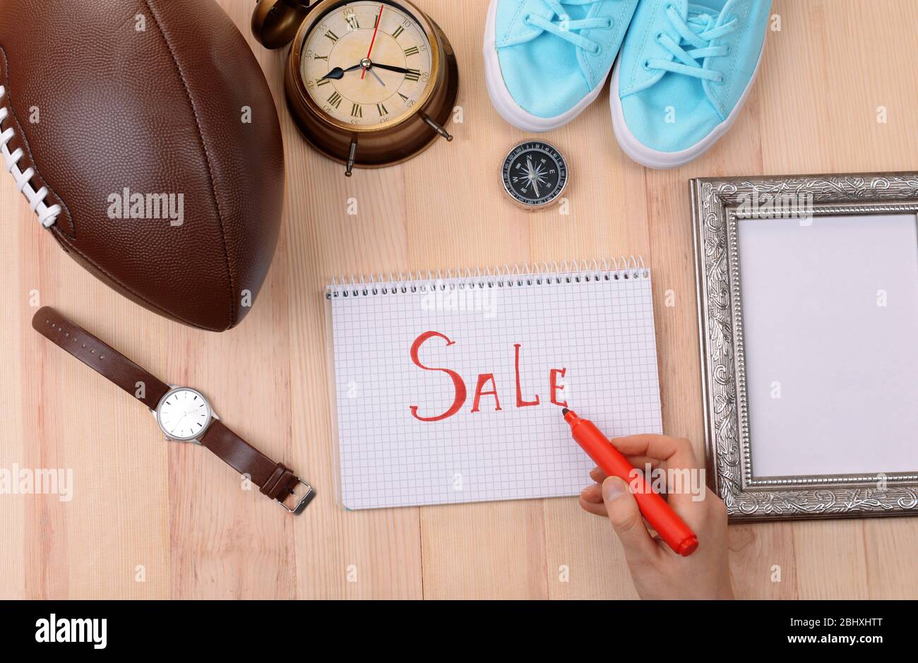 Sale unwanted stuff on wooden background top view Stock Photo - Alamy
