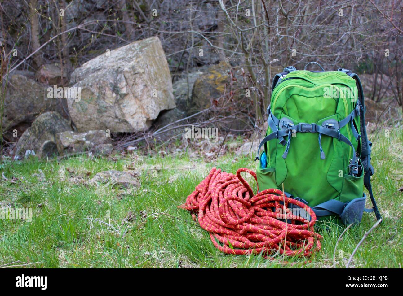Hiking backpack on nature background Stock Photo - Alamy