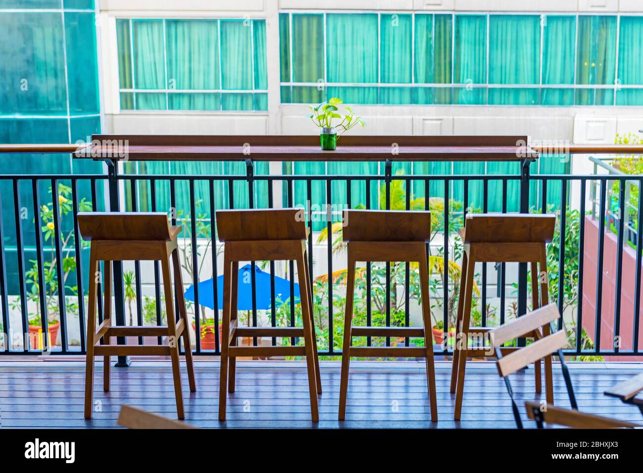 Table and chair on the terrace with wooden floor background Stock Photo ...