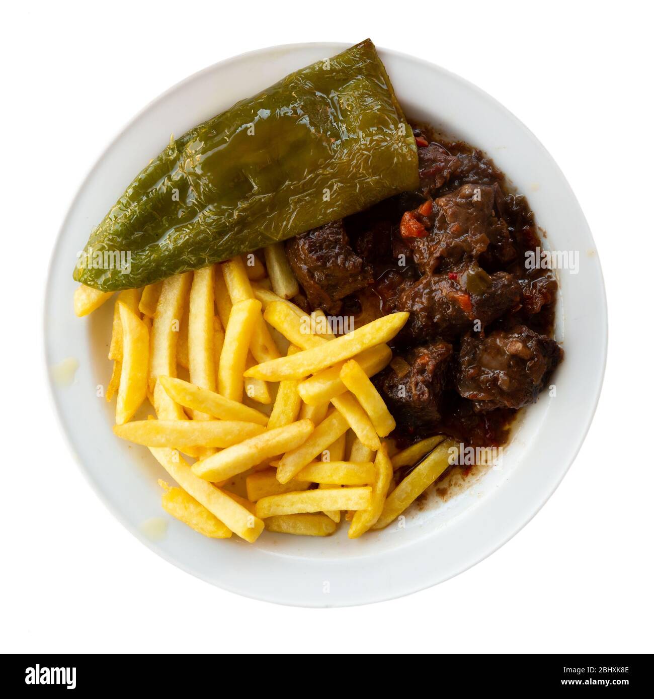 Spicy veal stewed with vegetables in red wine with side dish of fried ...