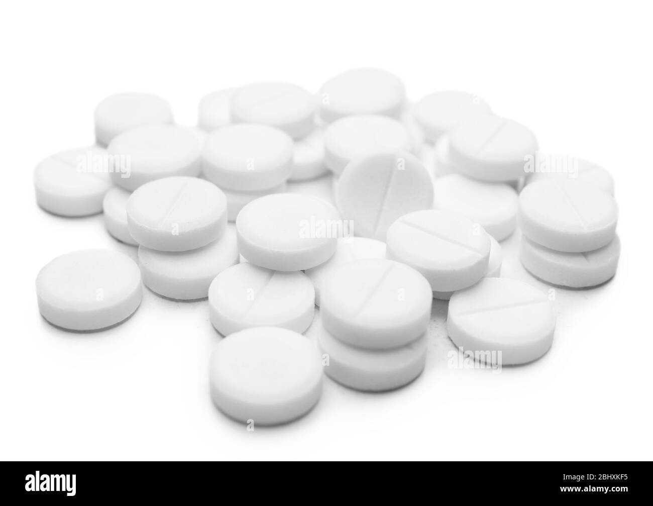 Pile of pills isolated on white Stock Photo - Alamy