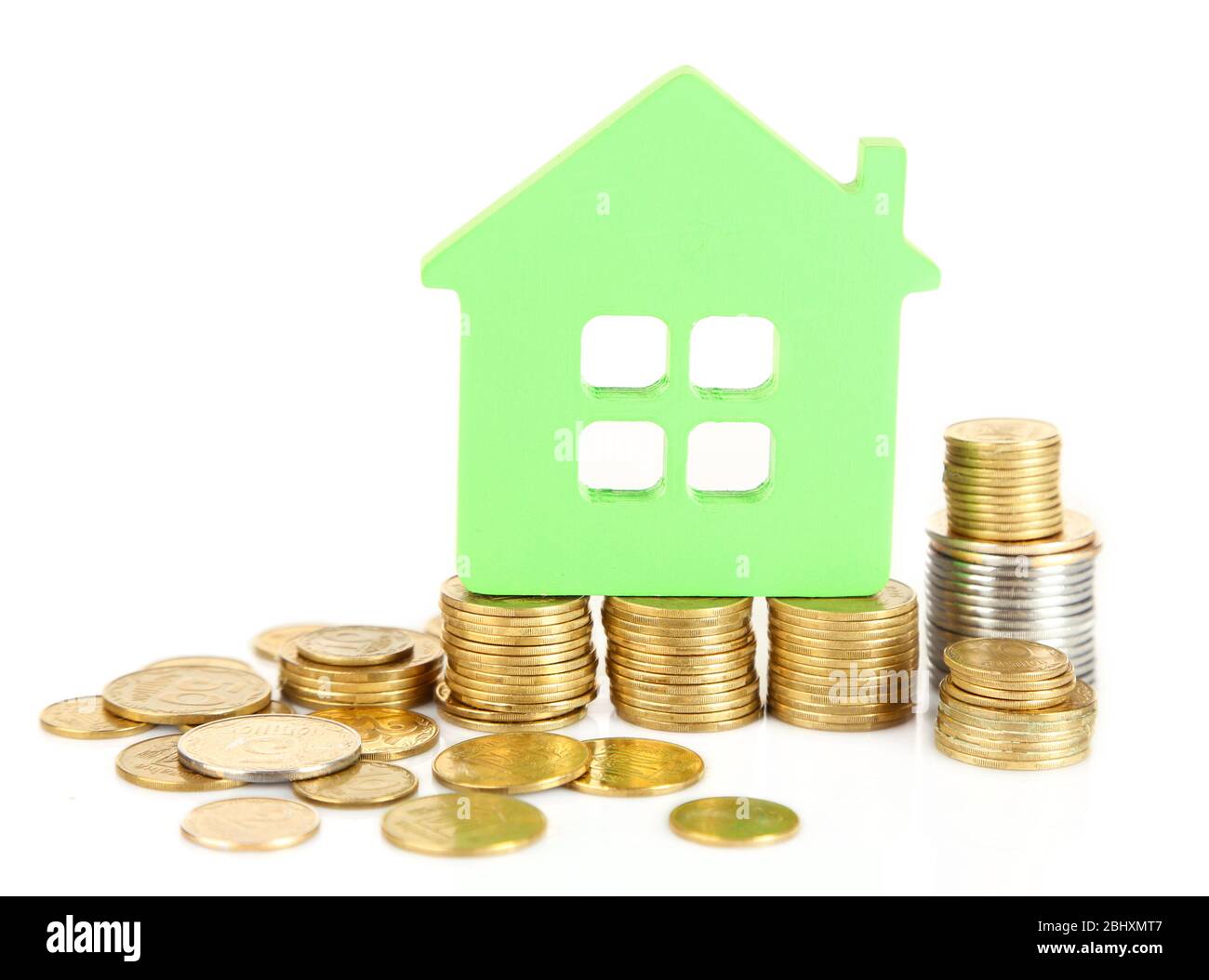 Model of house with coins isolated on white Stock Photo - Alamy