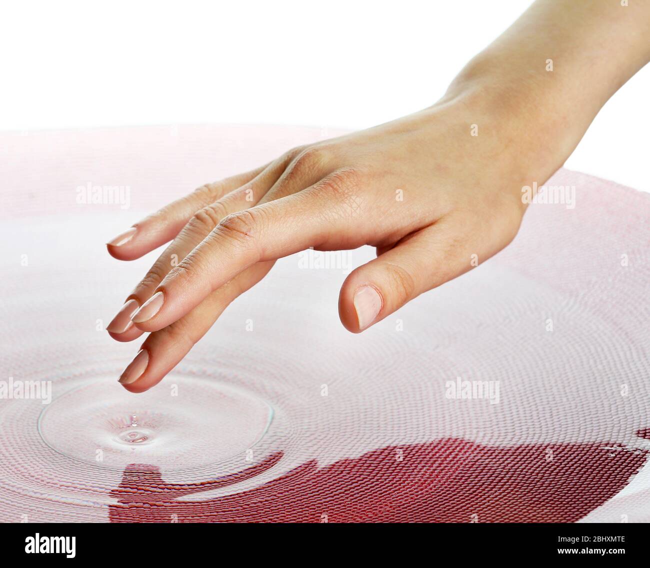 Finger touches water close up Stock Photo - Alamy