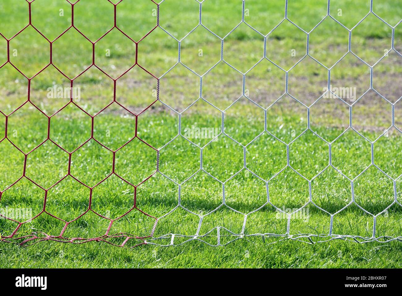 Football net on green grass background Stock Photo - Alamy