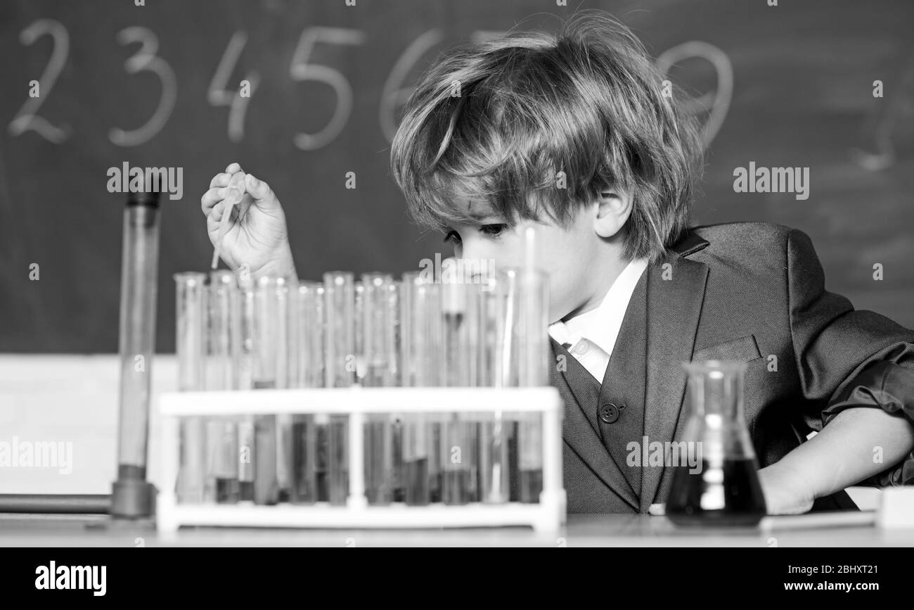 science experiments in lab. Little boy is making science experiments ...