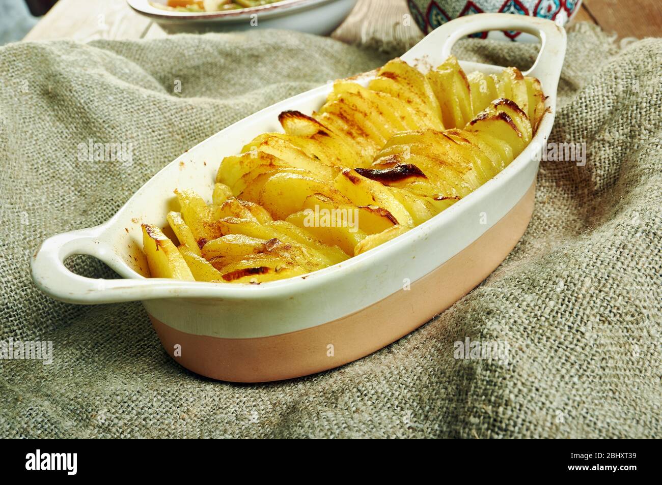 Crispy Leaf Potatoes -Best Roasted Potatoes Ever, sliced potatoes in a ...