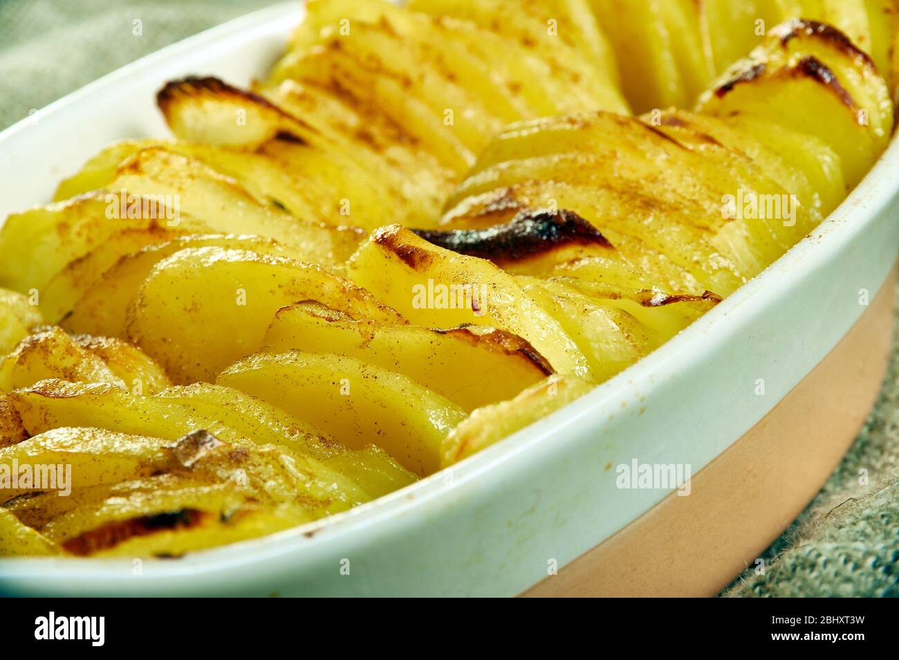 Crispy Leaf Potatoes -Best Roasted Potatoes Ever, sliced potatoes in a ...