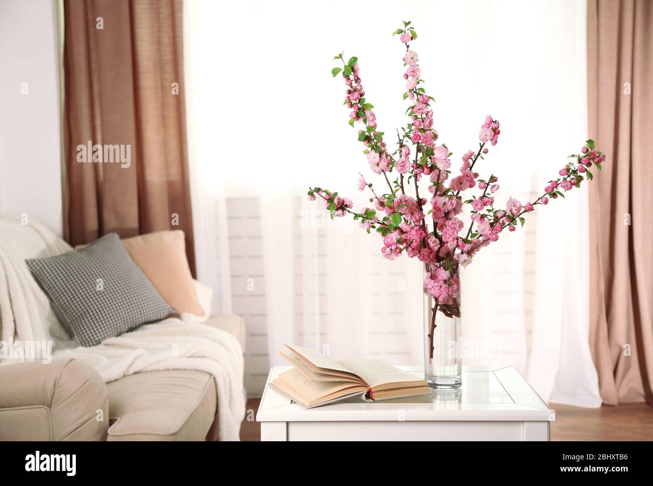 Spring bouquet in vase, on table, on home interior background Stock ...