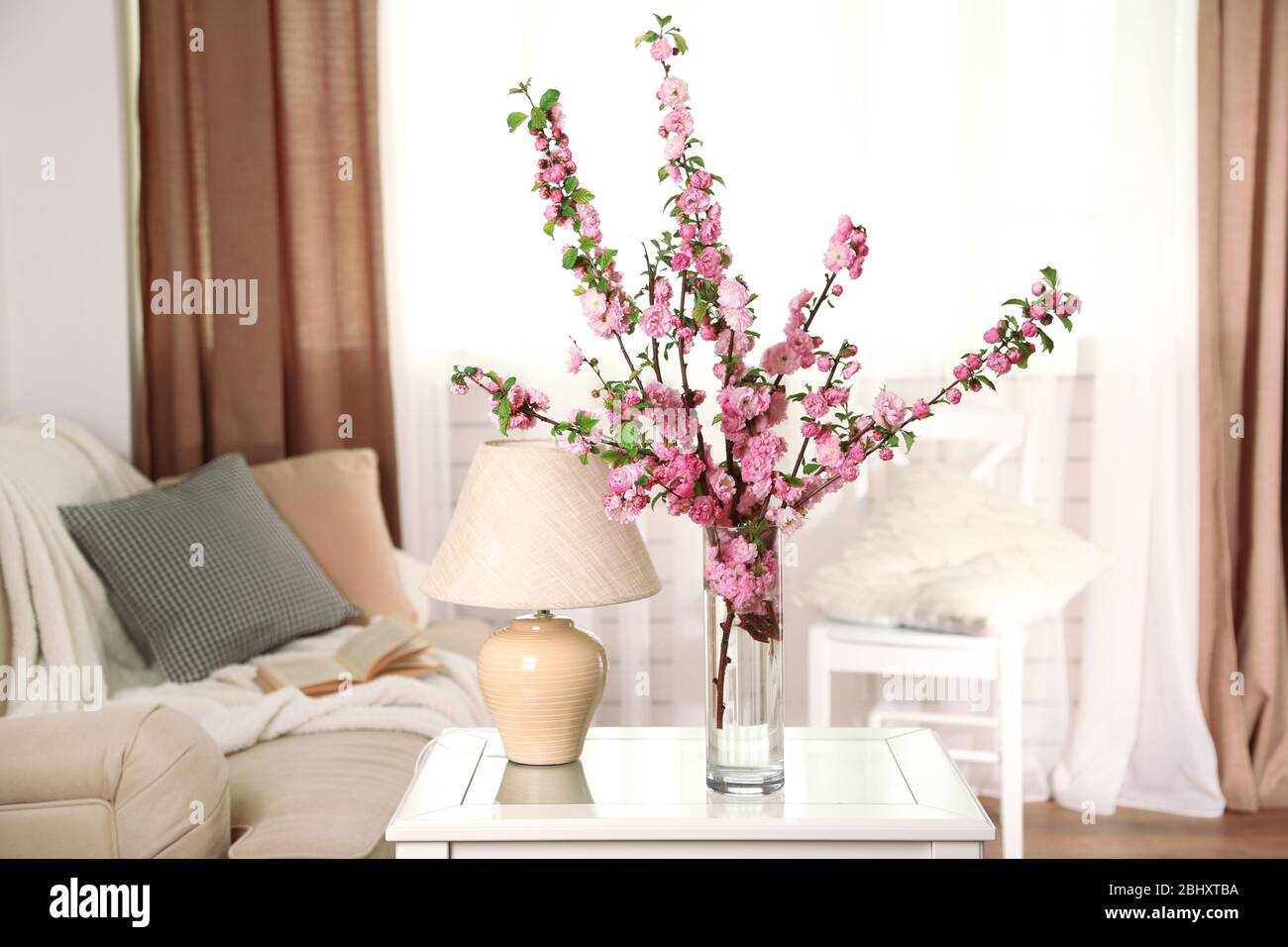 Spring bouquet in vase, on table, on home interior background Stock ...