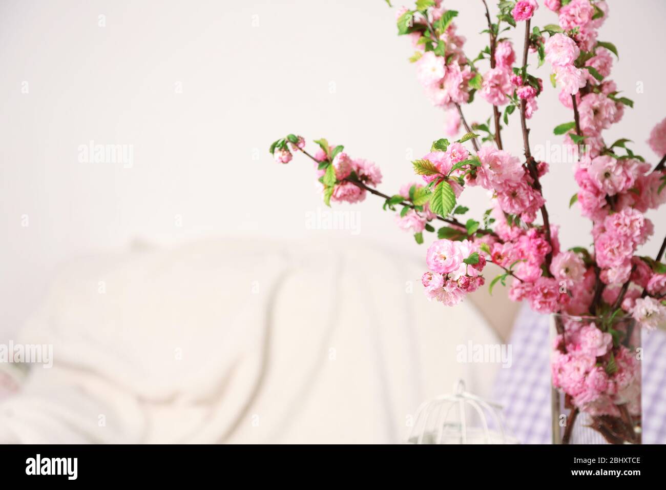 Spring bouquet in vase, on table, on home interior background Stock ...