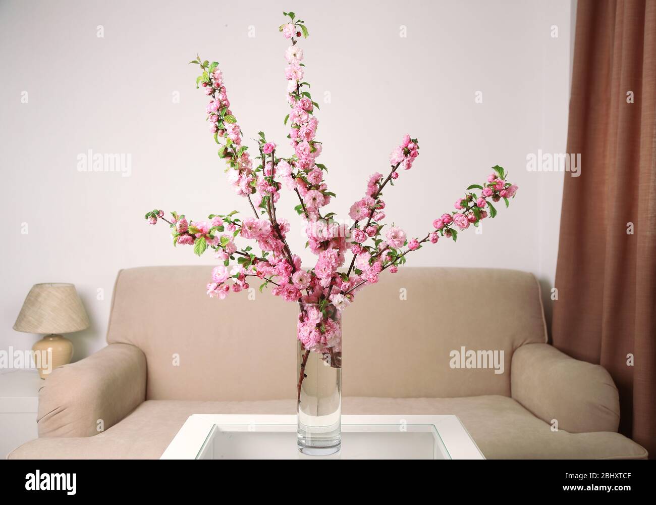 Spring bouquet in vase, on table, on home interior background Stock ...