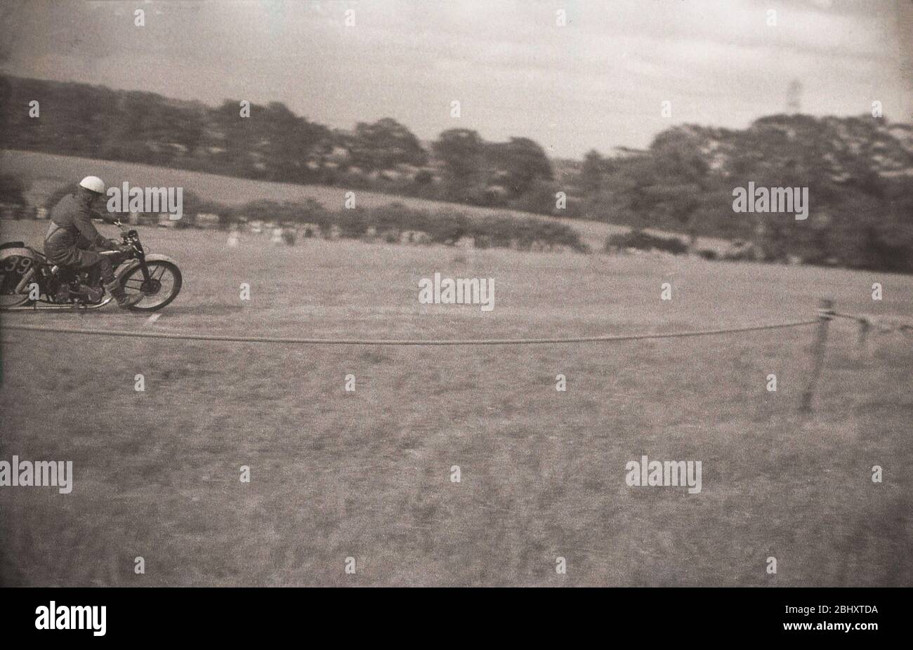 1950s, historical, motorsport, a scrambler on his motorcycle of the era ...